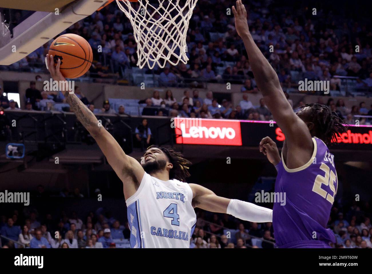 North Carolina guard R.J. Davis (4) drives to the hoop against James ...