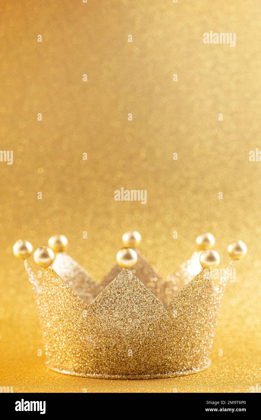 A Classic Golden Crown on a Golden Background Stock Photo - Alamy
