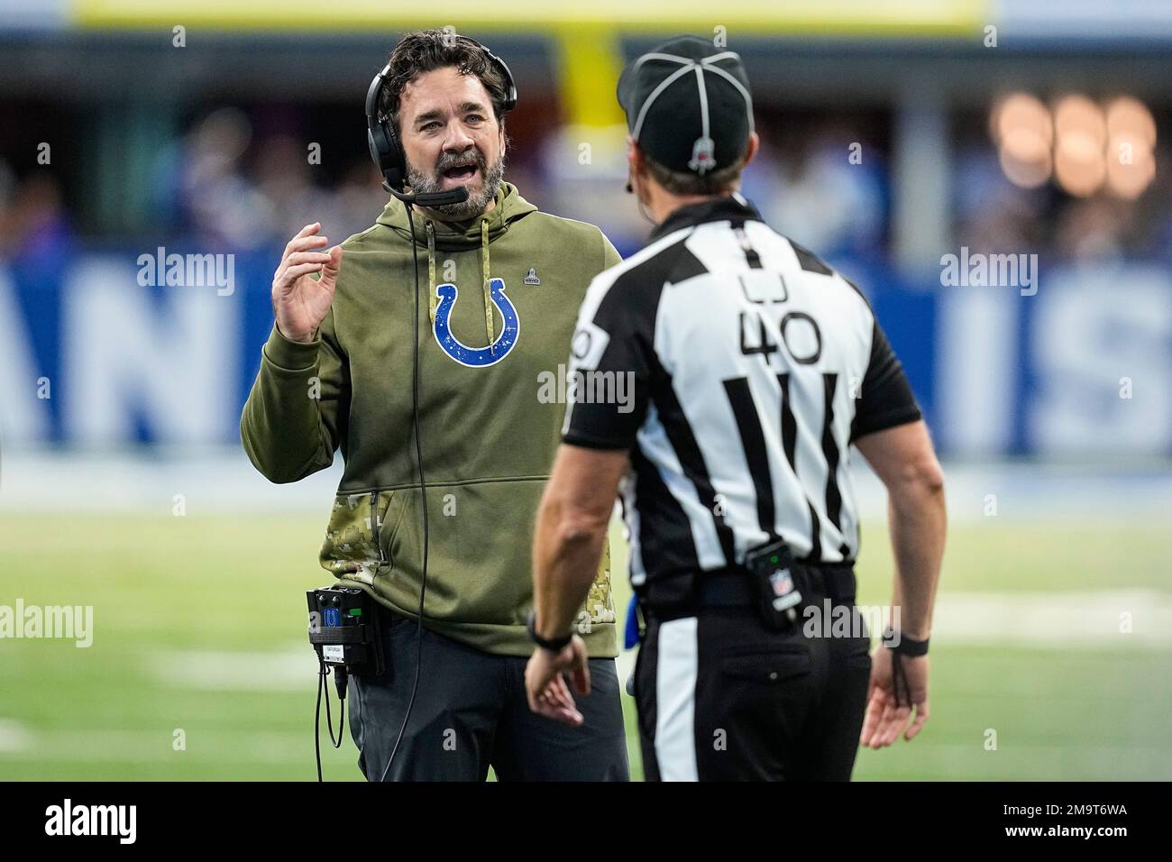 Indianapolis Colts head coach Jeff Saturday talks with line judge Brian ...