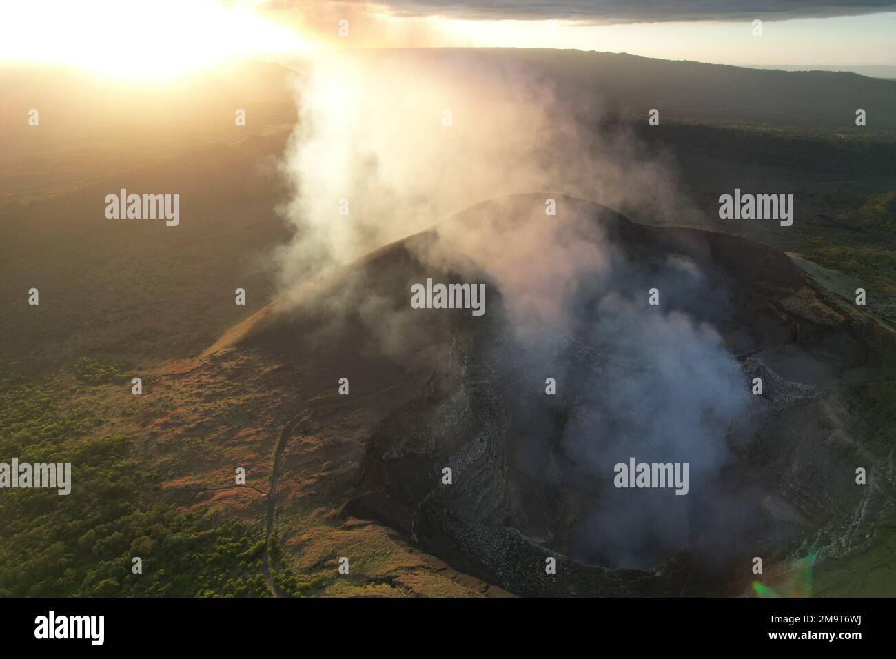 Masaya national park theme. Active volcano crater with smoke emission ...