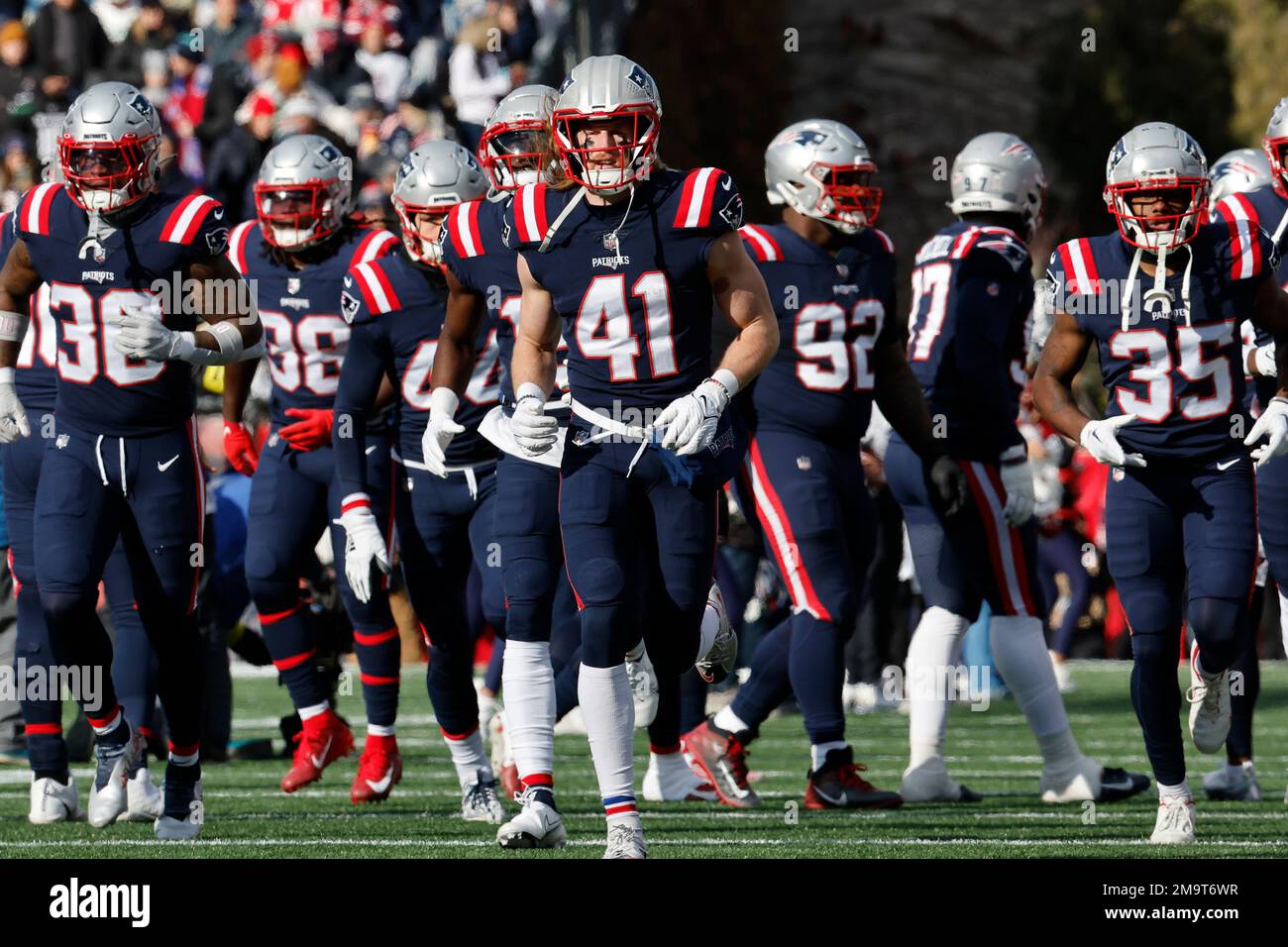 New England Patriots run onto the field prior to the first half of an ...