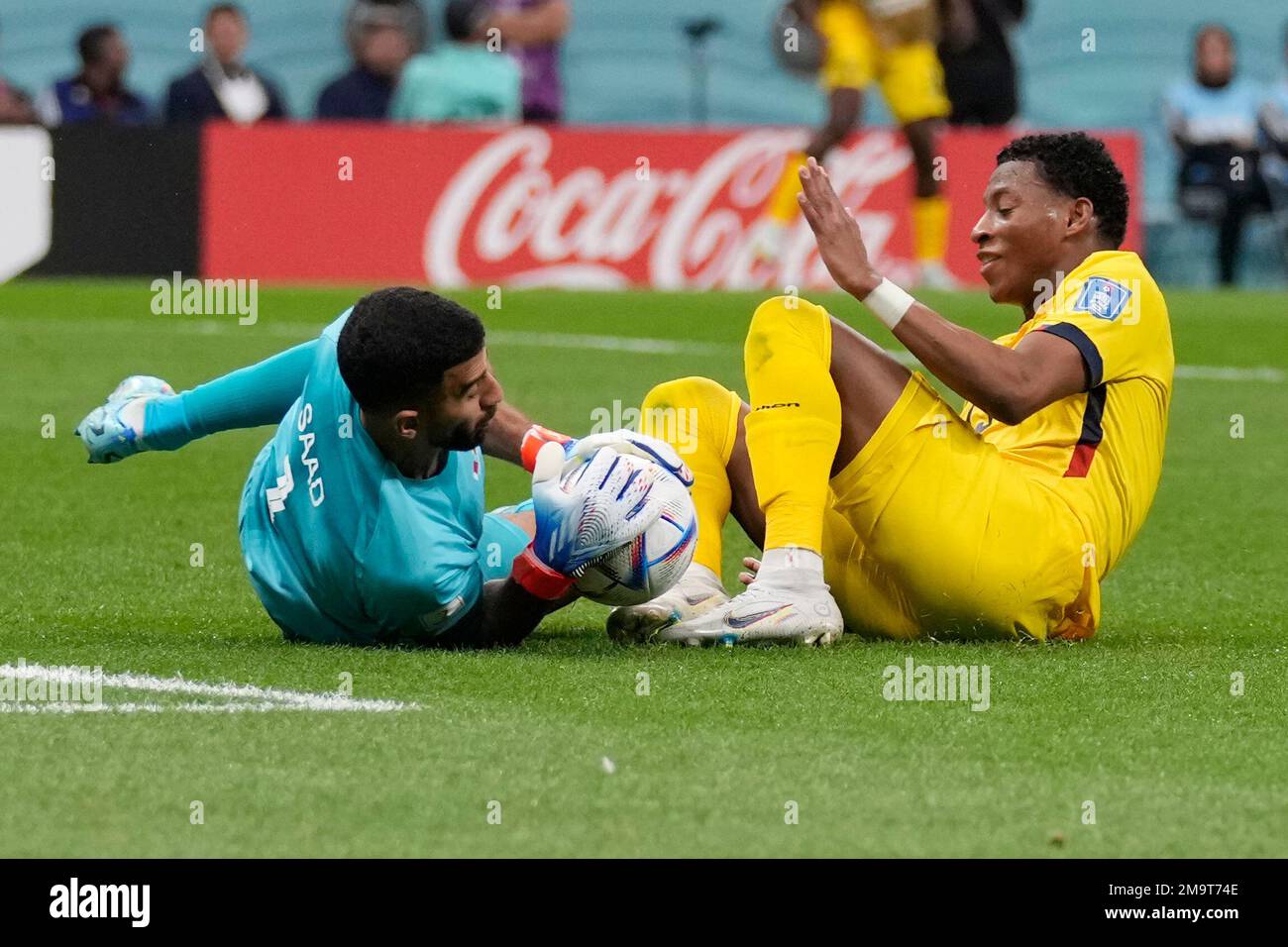 Qatar's goalkeeper Saad Al Sheeb saves on an attempt to score by ...