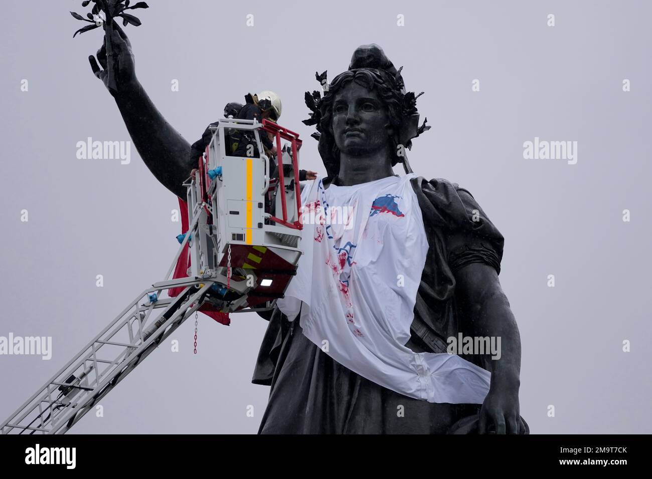 Paris fire brigade remove a shirt with written "Qatar stinks of death ...