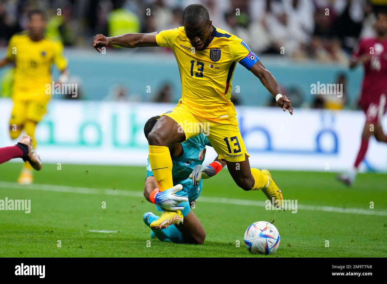 Qatar's goalkeeper Saad Al Sheeb fouls Ecuador's Enner Valencia during ...