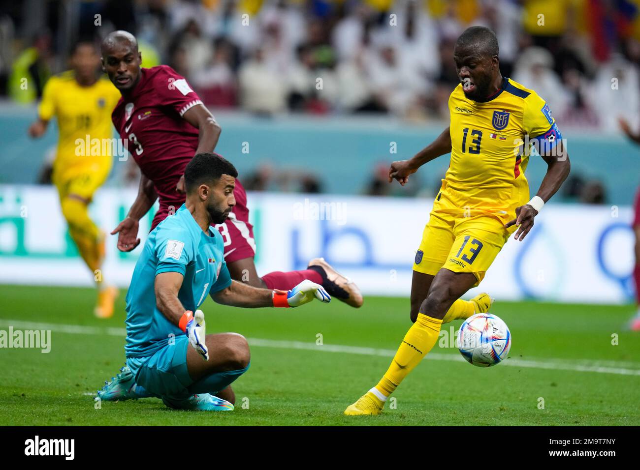 Qatar's goalkeeper Saad Al Sheeb challenges Ecuador's Enner Valencia ...