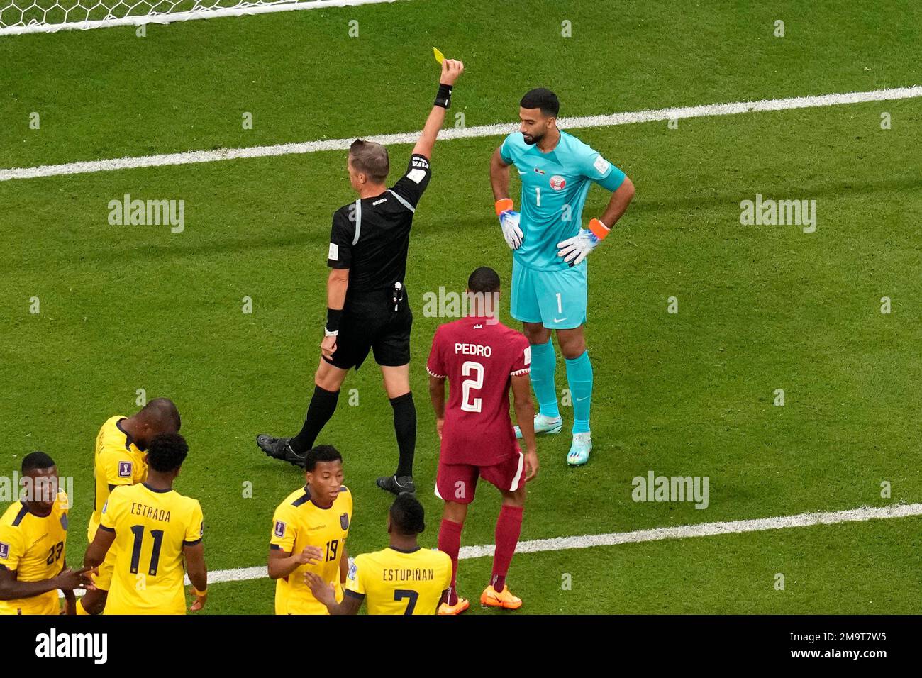 Qatar's goalkeeper Saad Al Sheeb receives the yellow card during the ...