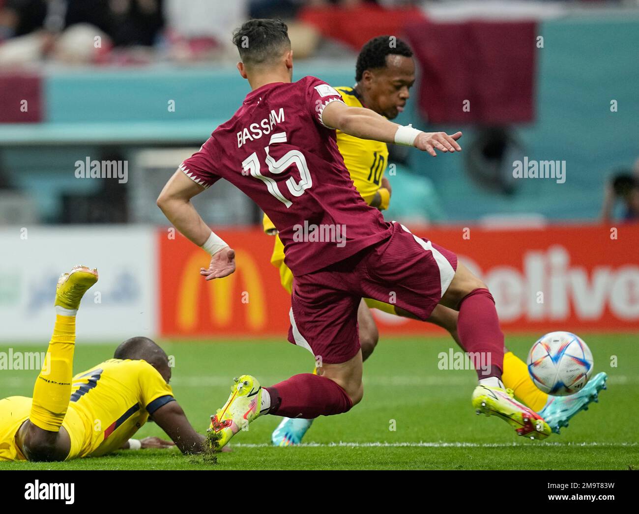 Qatar's Bassam Al-Rawi, front right, duels for the ball with Ecuador's ...