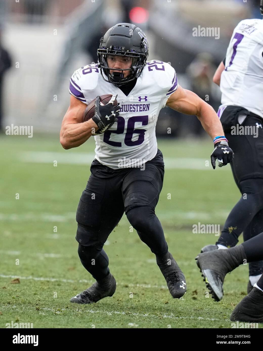 Northwestern running back Evan Hull (26) runs against Purdue during the ...
