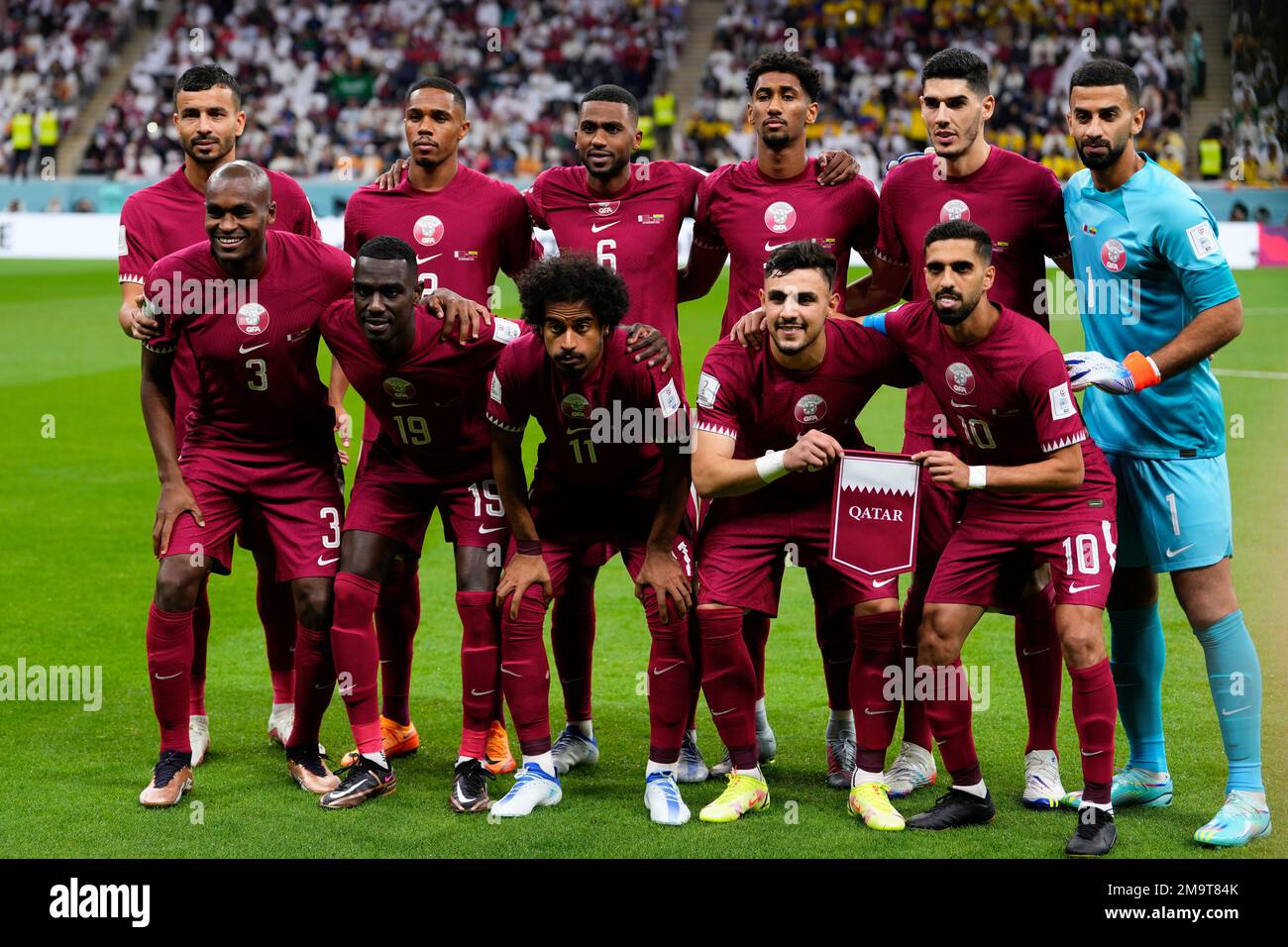 Players of Qatar pose for a group photo prior to their World Cup group ...