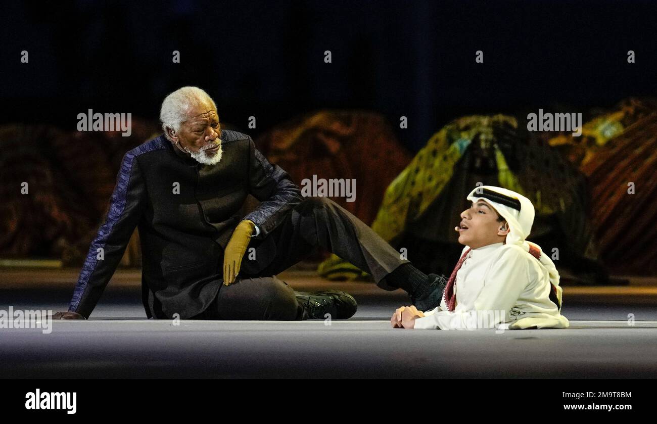 US actor Morgan Freeman, left, sits on the stage next to FIFA World Cup ...