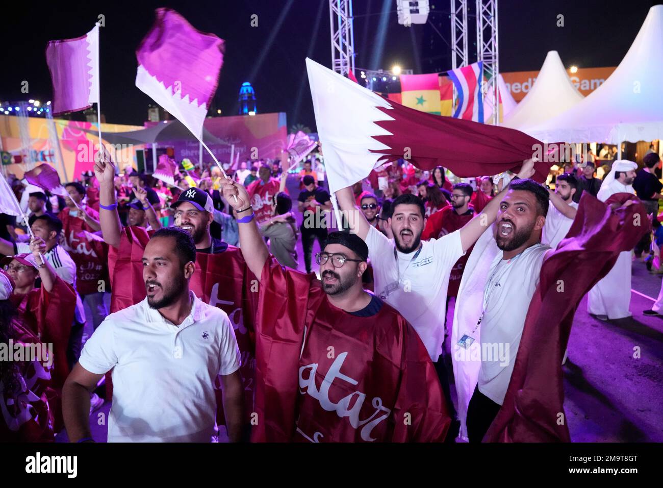Qatar soccer fans celebrate as they wait for the World Cup, group A ...