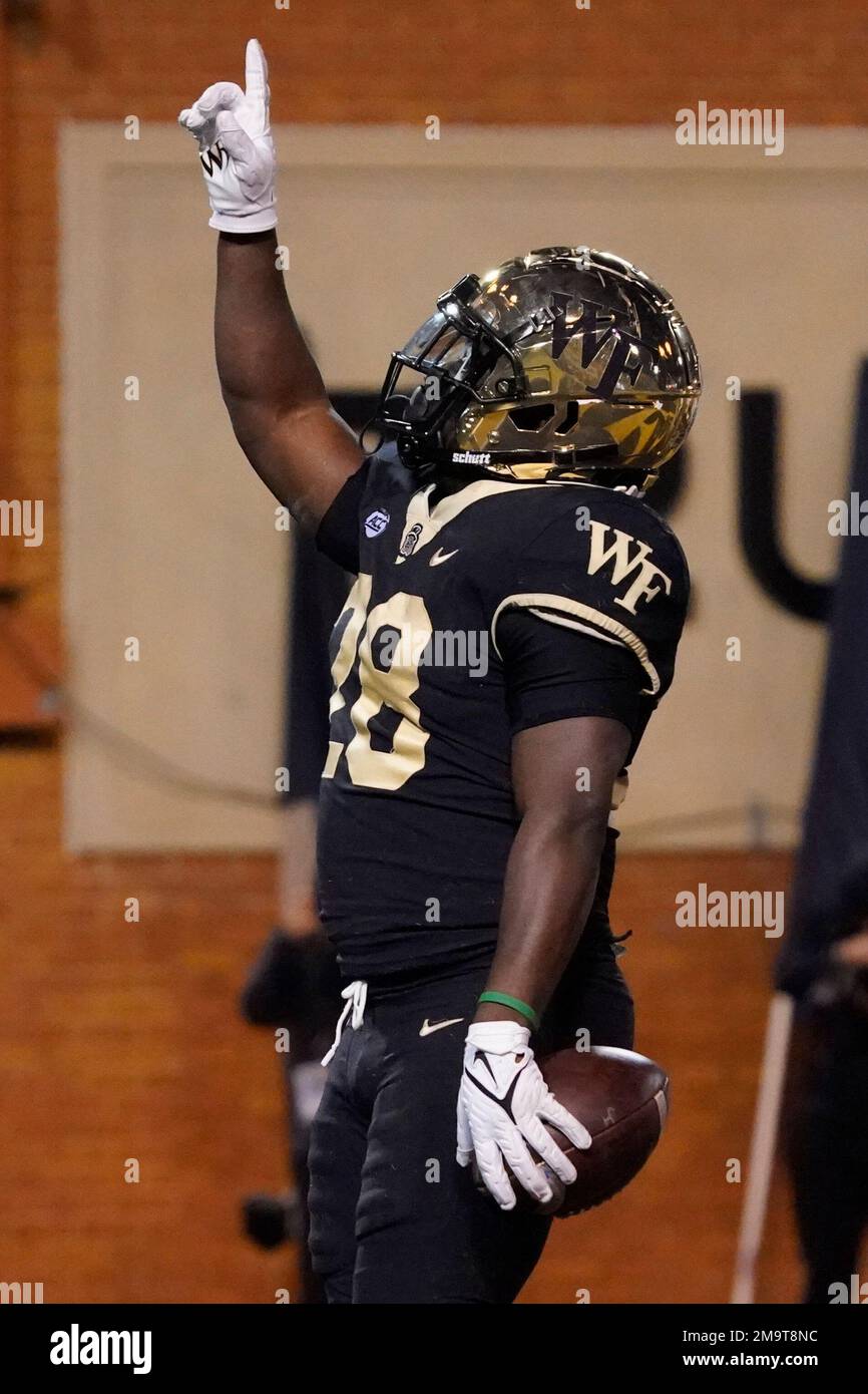 Wake Forest running back Quinton Cooley (28) celebrates his touchdown ...