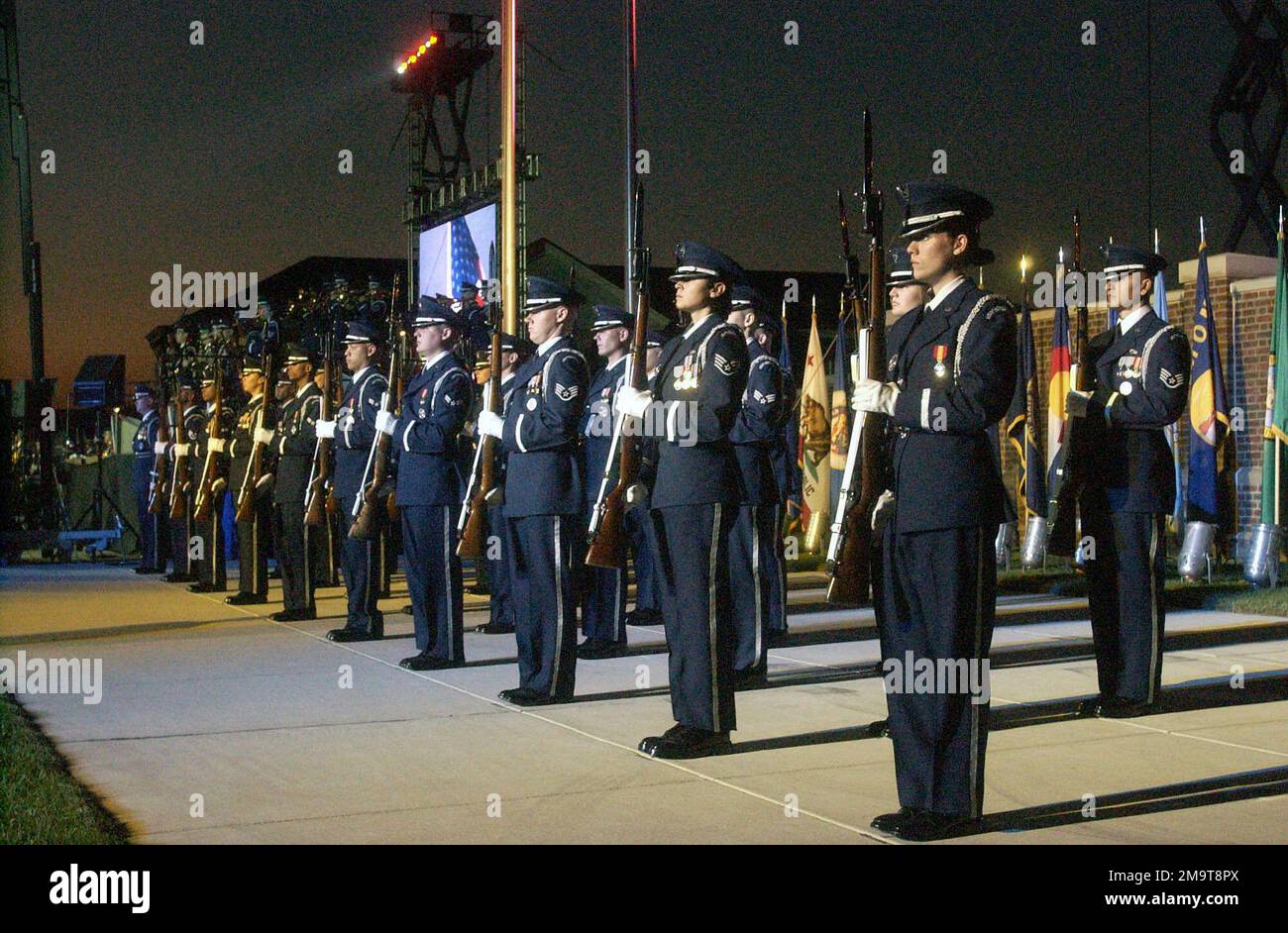 The US Air Force (USAF) Honor Guard present arms for the playing of the ...