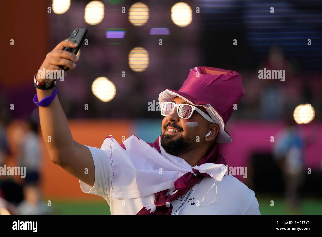 A Qatar fan takes a selfie as he waits for the World Cup, group A ...