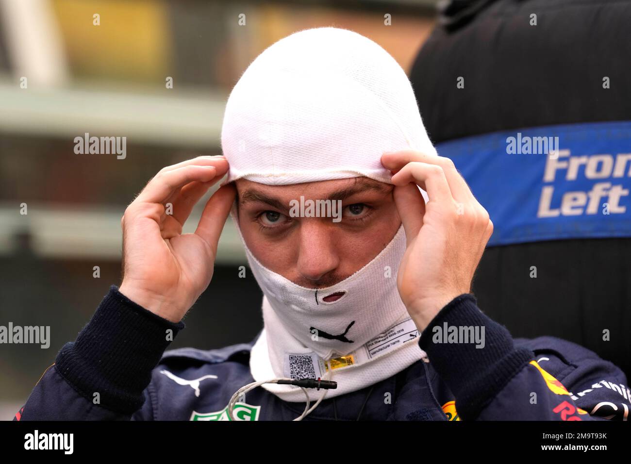 Red Bull driver Max Verstappen of the Netherlands adjusts his mask at ...