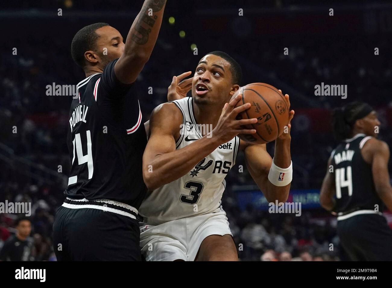 San Antonio Spurs forward Keldon Johnson (3) tries to shoot against Los ...
