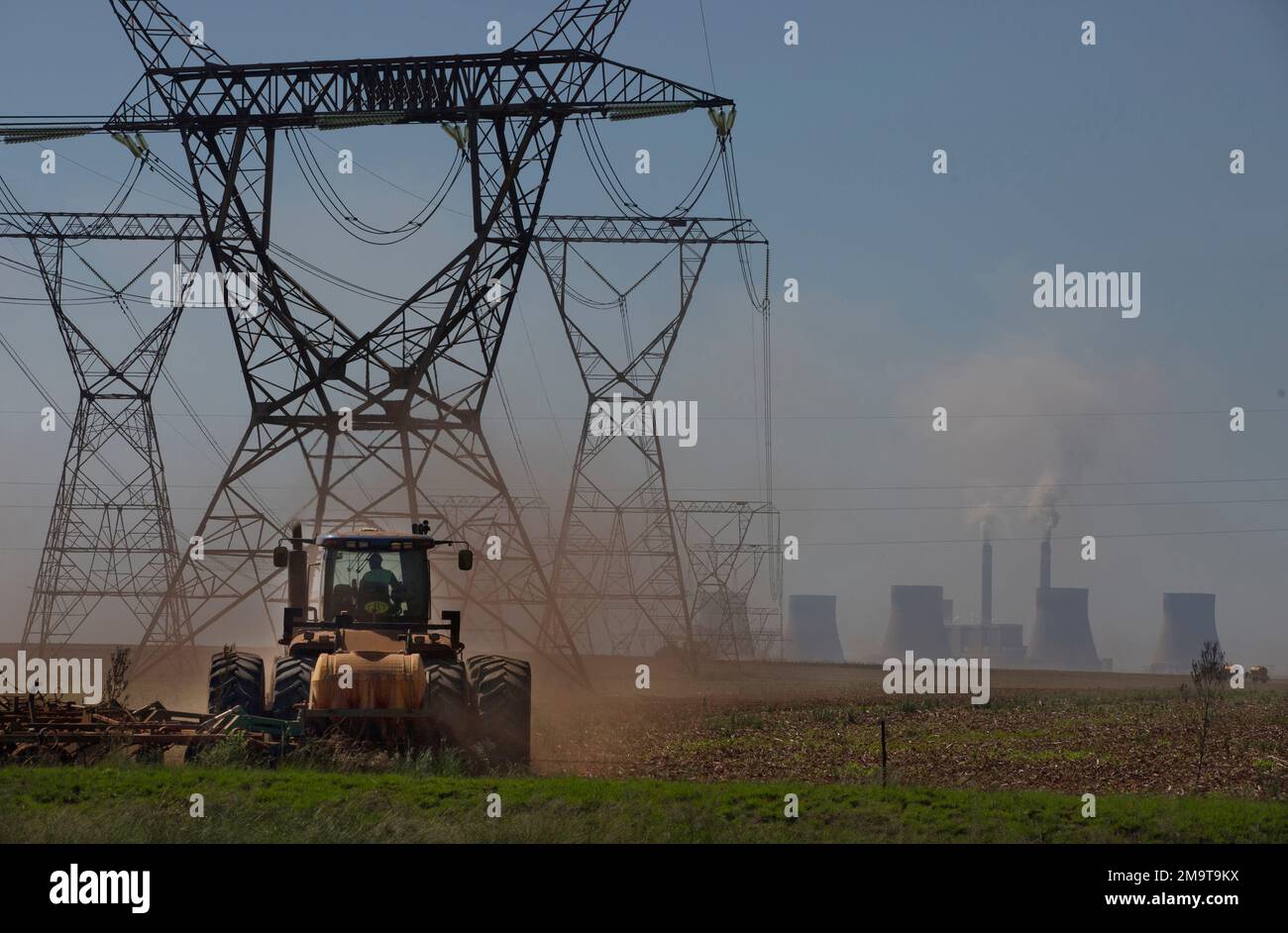 The land is ploughed under electrical pylons leading from a coal ...