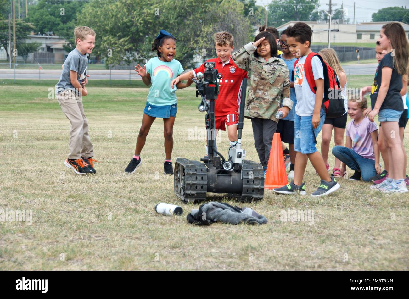 Meadows Elementary School students interact with a remote-controlled, heavy-duty robot at the ...
