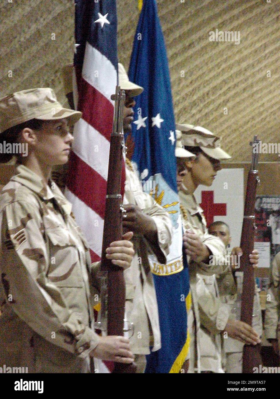 US Air Force (USAF) members of the base Honor Guard prepare to post the ...