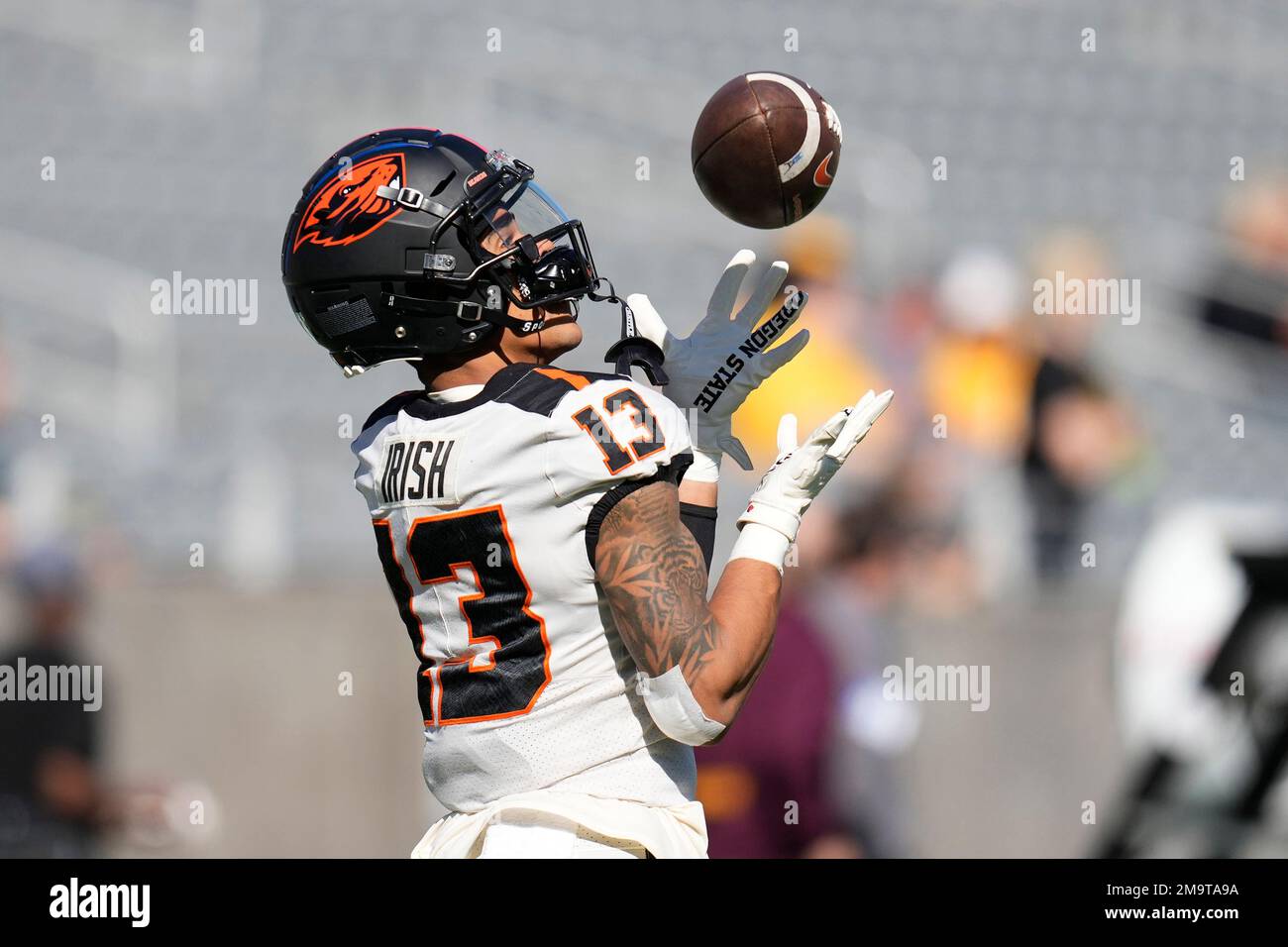 Oregon State wide receiver Jesiah Irish (13) reaches out to make a ...