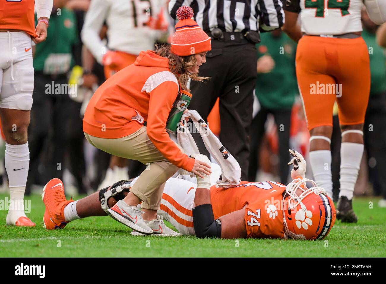 Clemson offensive lineman Marcus Tate (74) is shaken up after a play ...