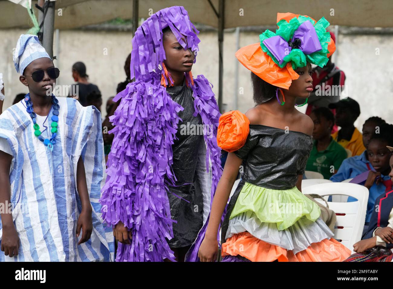 Rose Musa, right, wearing an outfit made from recycled plastic bags ...