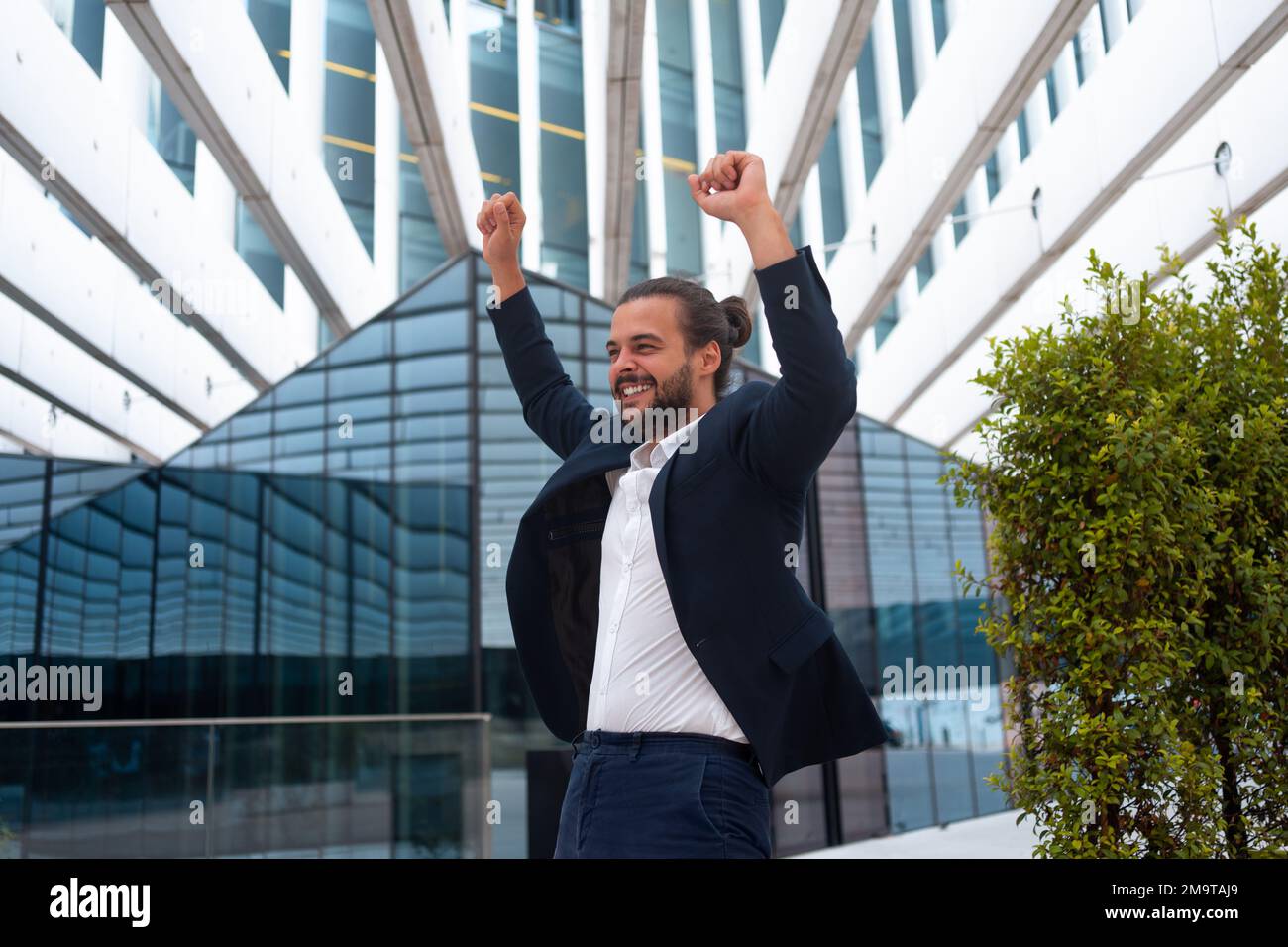 Businessman arms up celebrating victory hi-res stock photography and ...