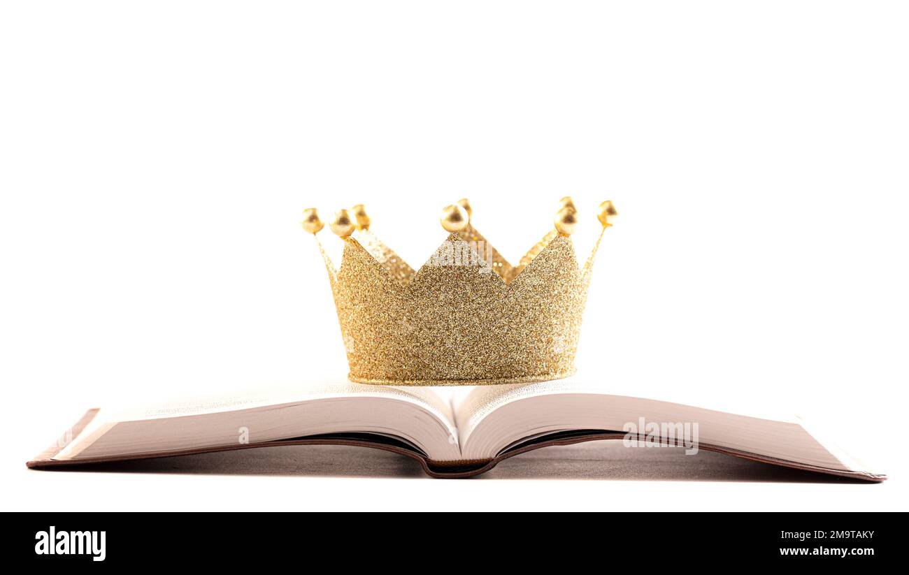 A Golden Crown on a Holy Bible Isolated on a White Background Stock ...