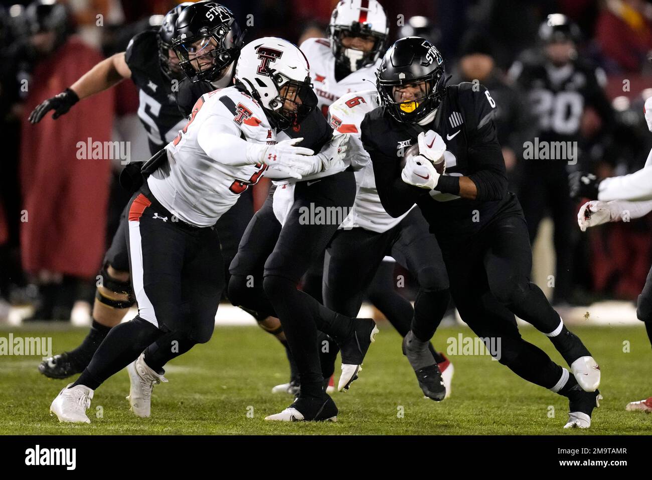 Iowa State quarterback Hunter Dekkers, right, runs from Texas Tech ...