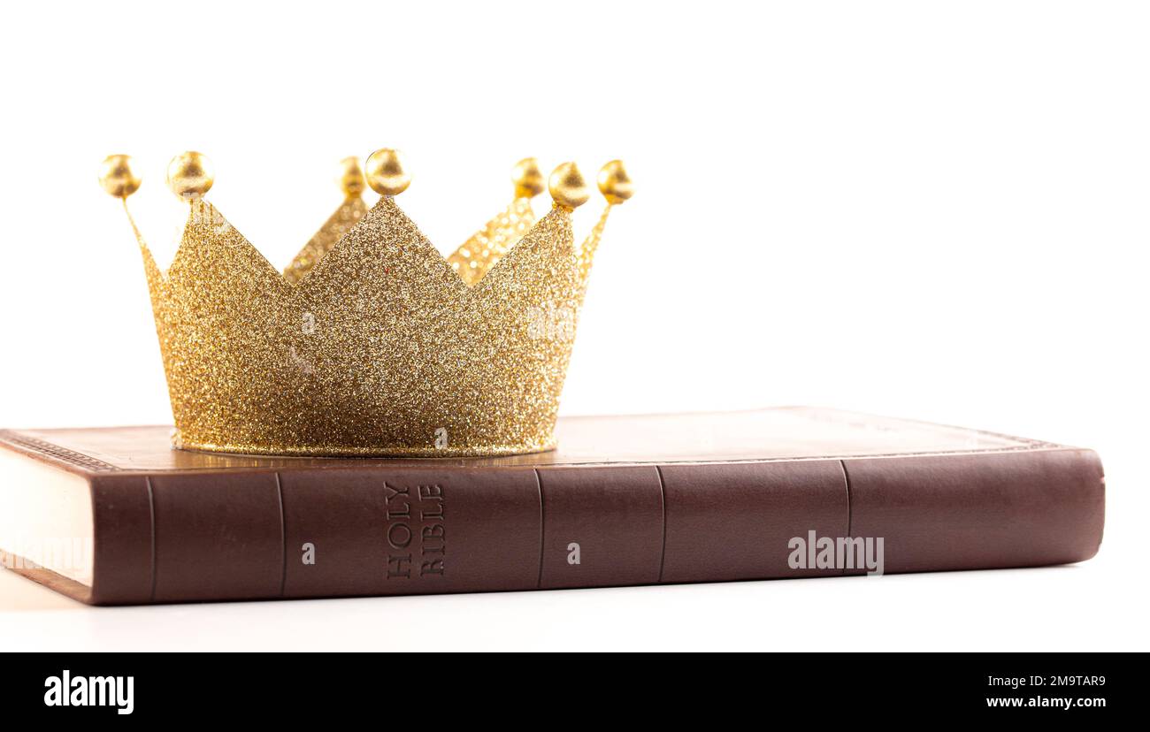 A Golden Crown on a Holy Bible Isolated on a White Background Stock ...