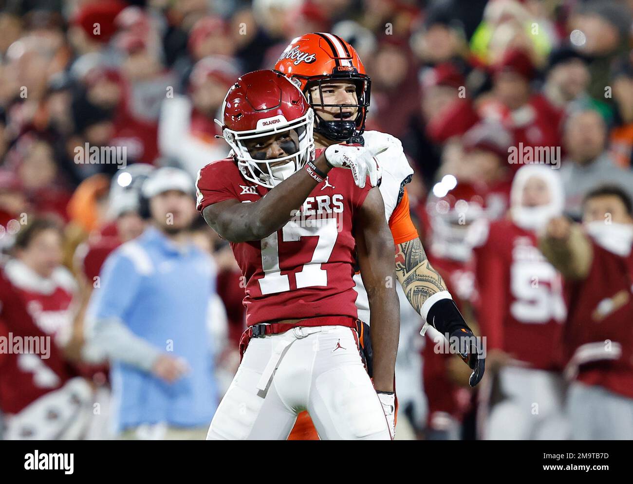 Oklahoma wide receiver Marvin Mims Jr. (17) gestures after running for ...