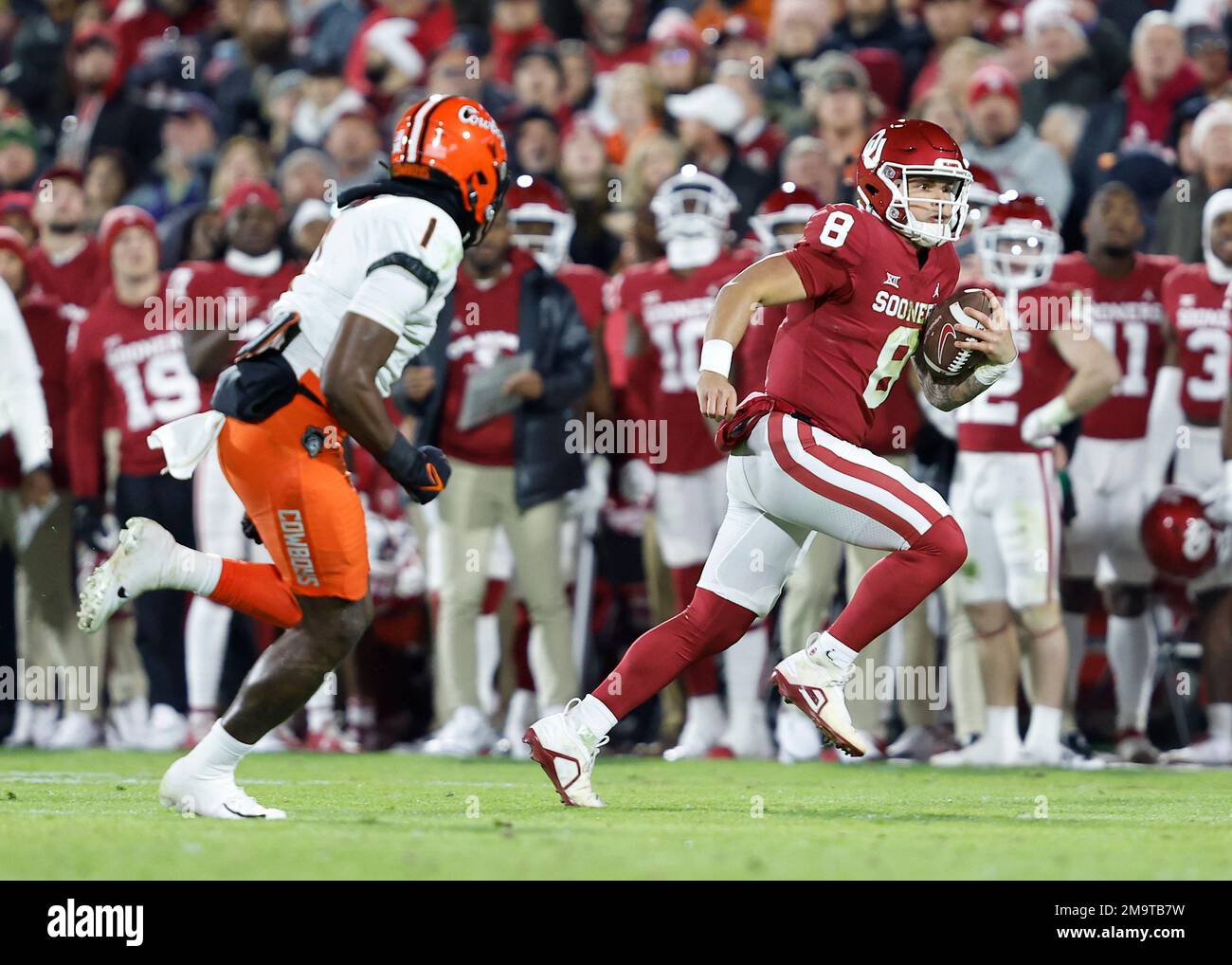 Oklahoma quarterback Dillon Gabriel (8) runs ahead of Oklahoma State ...