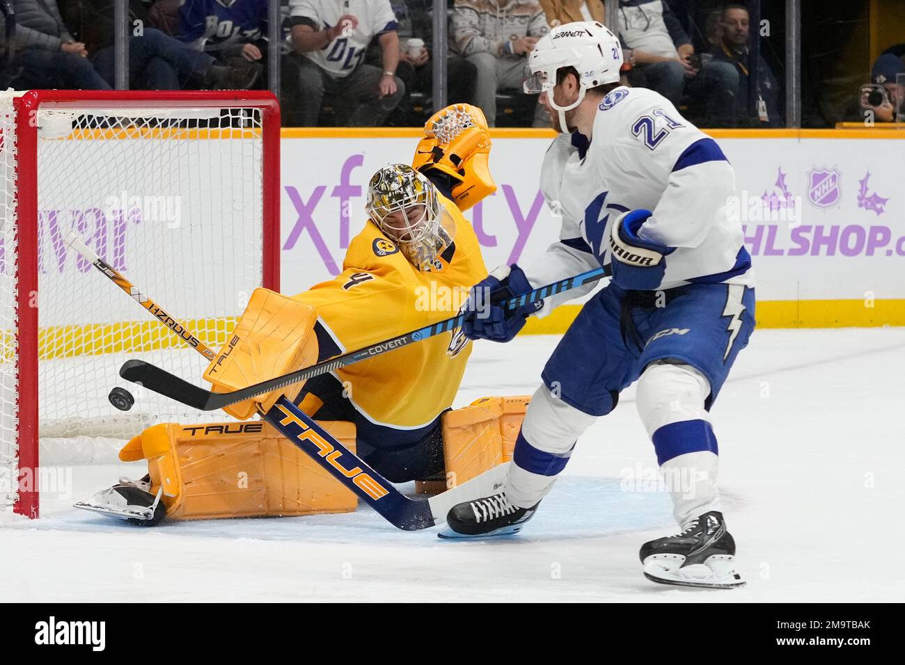 Nashville Predators goaltender Juuse Saros (74) blocks a shot by Tampa ...