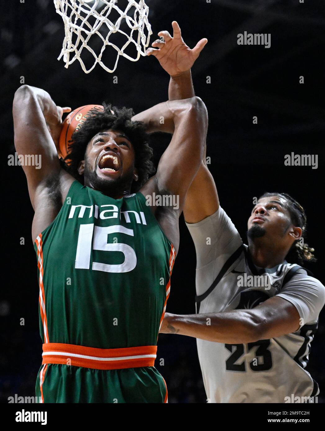 Providence forward Bryce Hopkins (23) fouls Miami forward Norchad Omier ...
