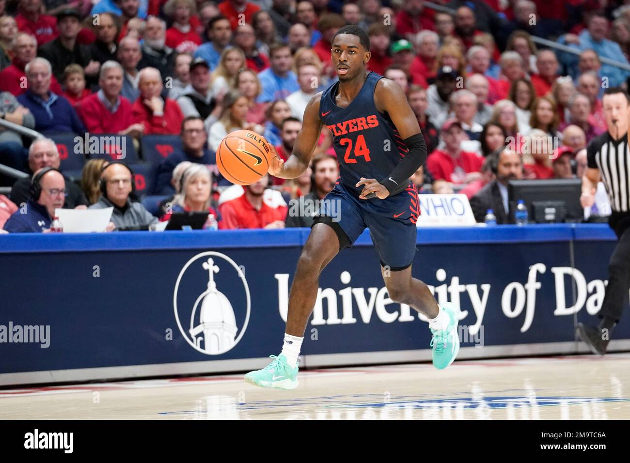 Dayton guard Kobe Elvis (24) dribbles the ball during the first half of ...