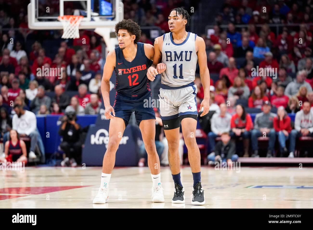 Dayton forward Zimi Nwokeji (12) and Robert Morris forward Stephaun ...