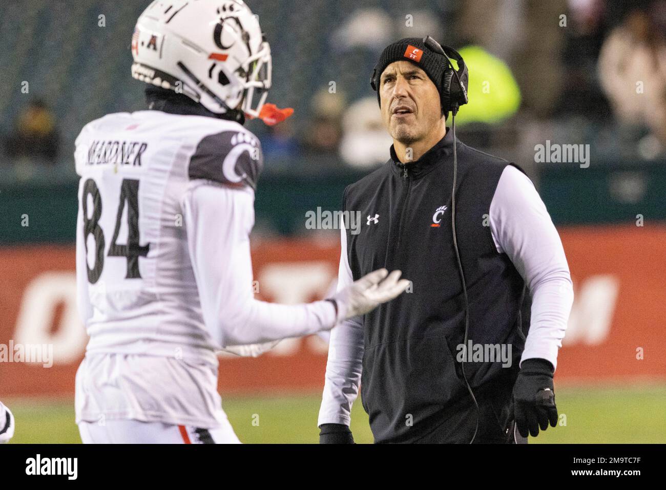 Cincinnati head coach Luke Fickell, right, talks with wide receiver ...