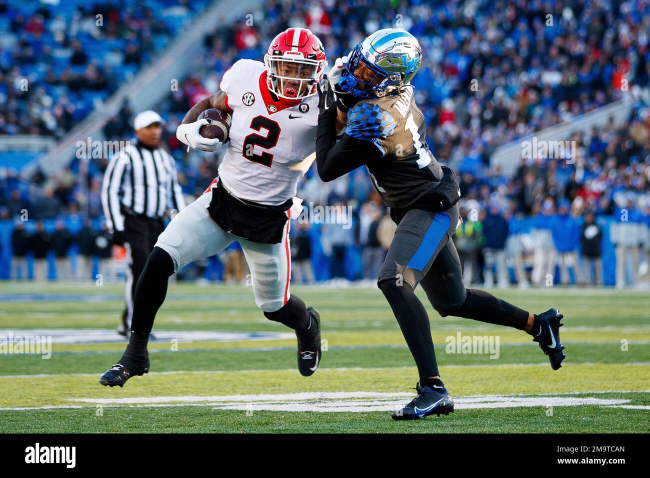 Georgia running back Kendall Milton (2) stiff arms Kentucky defensive ...