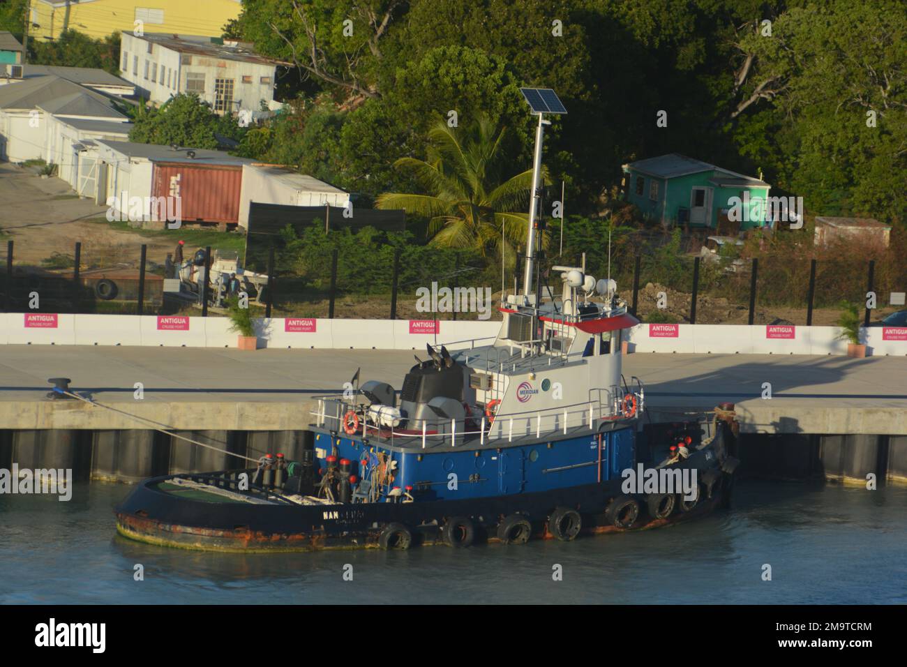Tug boat sitting at the dock Stock Photo - Alamy