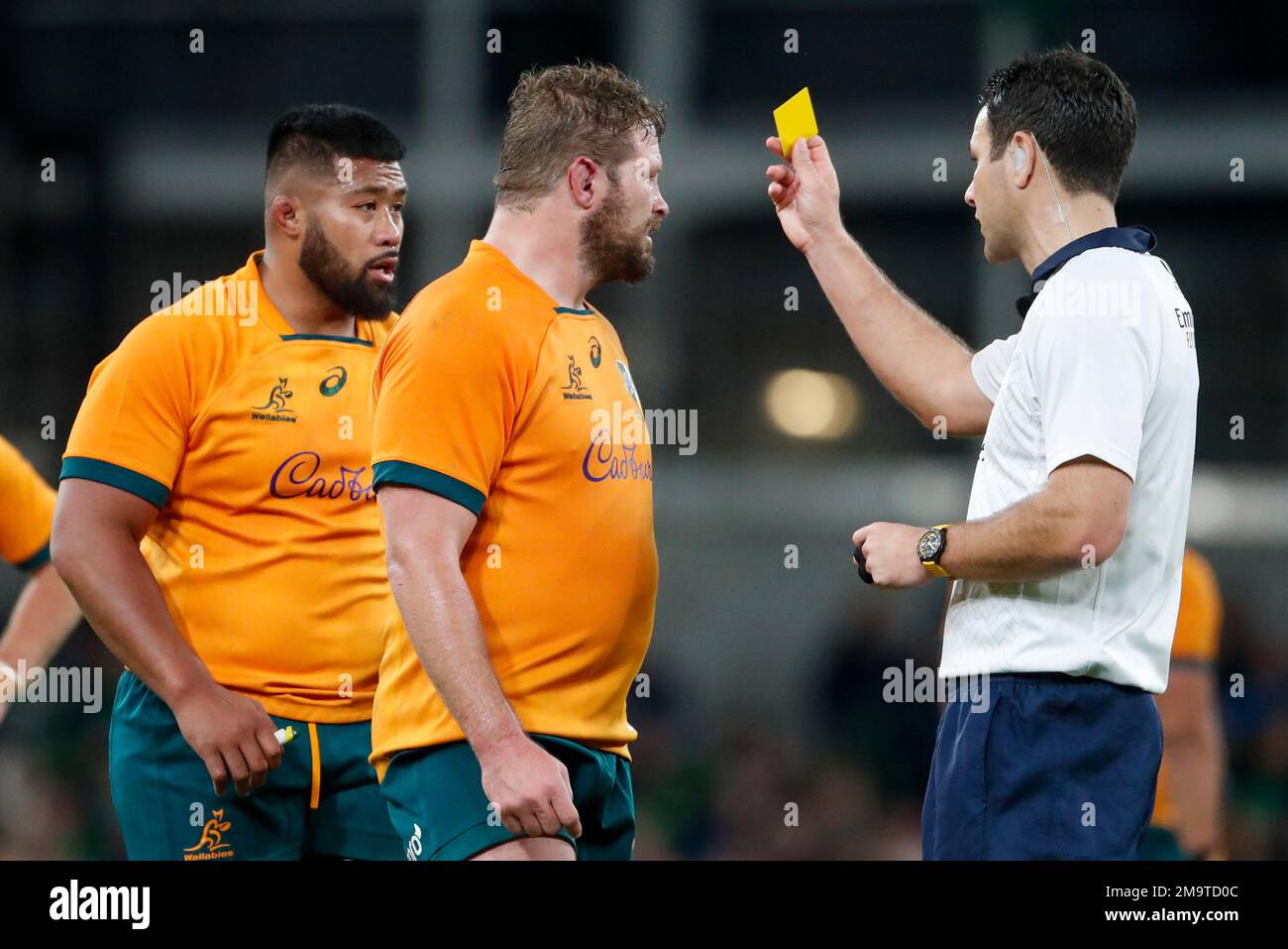 Referee Ben O'Keef shows a yellow card to Australia's Folau Fainga'a ...