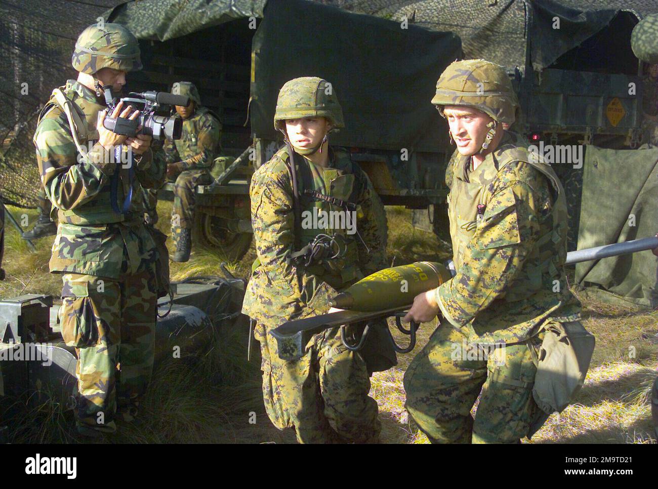 031015-M-9382M-021. US Marine Corps (USMC) Corporal (CPL) McBride, left ...