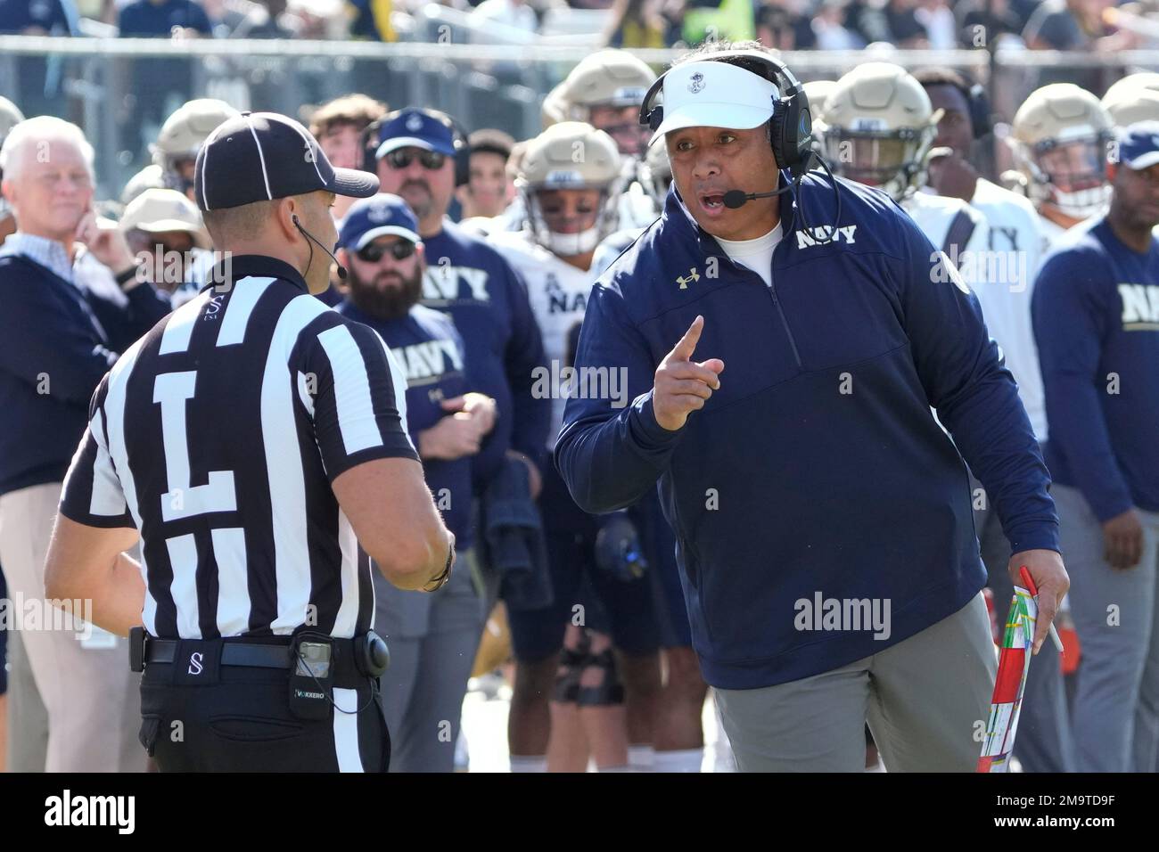 Navy head coach Ken Niumatalolo has words with line judge Alex Amaya ...