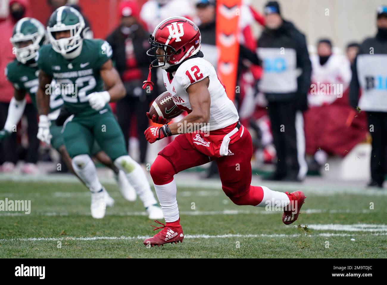 Indiana running back Jaylin Lucas (12) returns a kickoff 88-yards for a ...