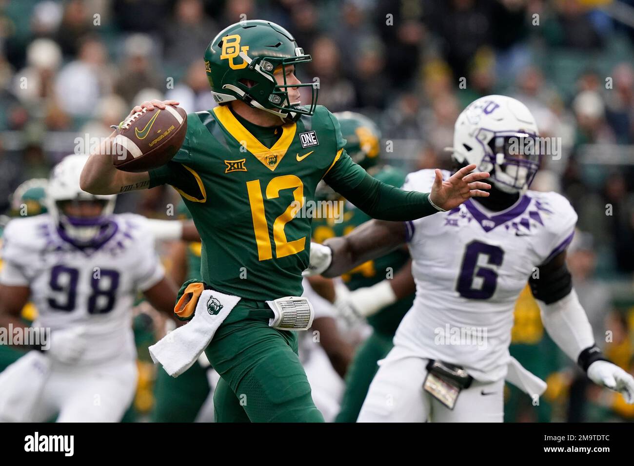 Baylor quarterback Blake Shapen (12) passes in front of TCU defenders ...