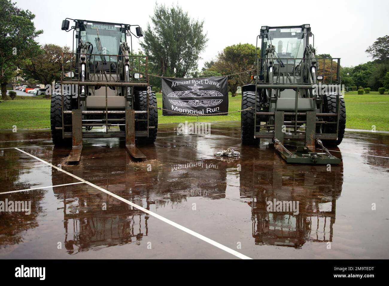 Forklifts display a banner for the annual Port Dawg Memorial Run at ...