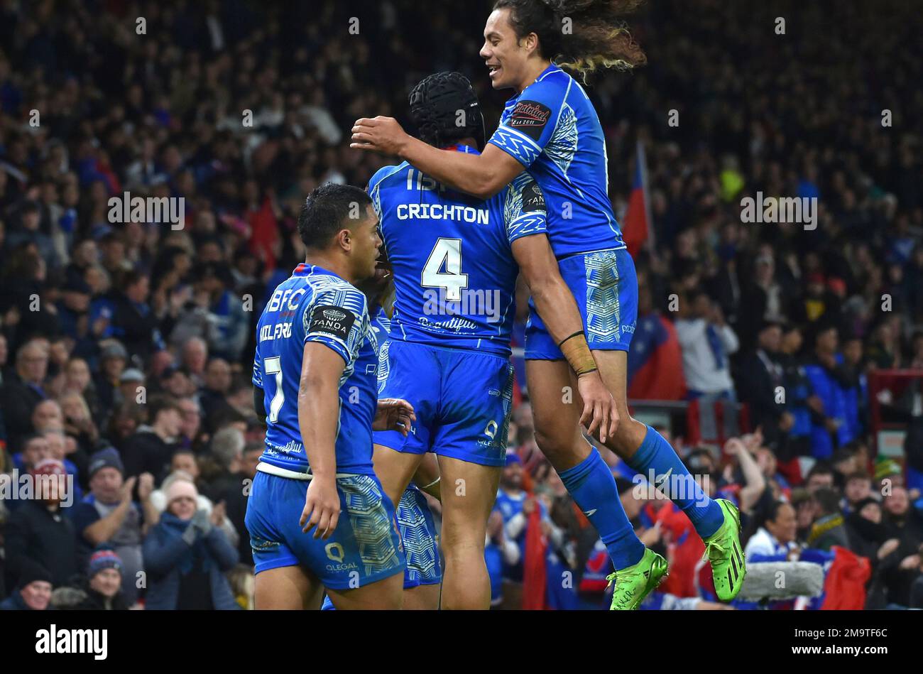 Samoa's Stephen Crichton, centre, celebrates after scoring a try during ...