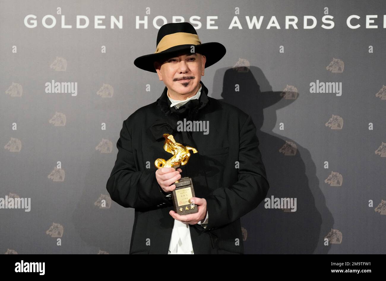 Hong Kong actor Anthony Wong holds his award for Best Leading Actor at ...