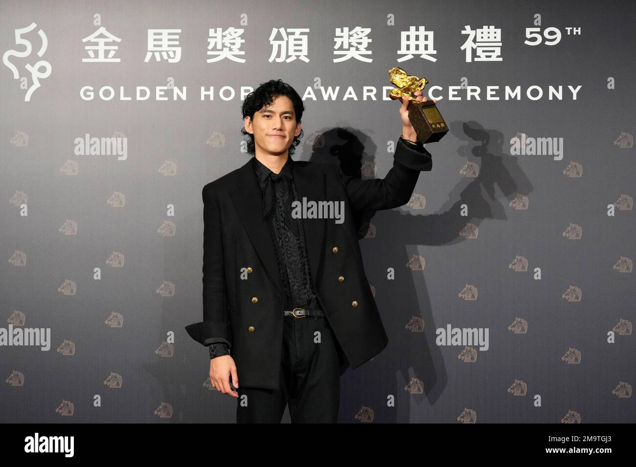 Taiwanese actor Berant Zhu holds his award for Best Supporting Actor at ...