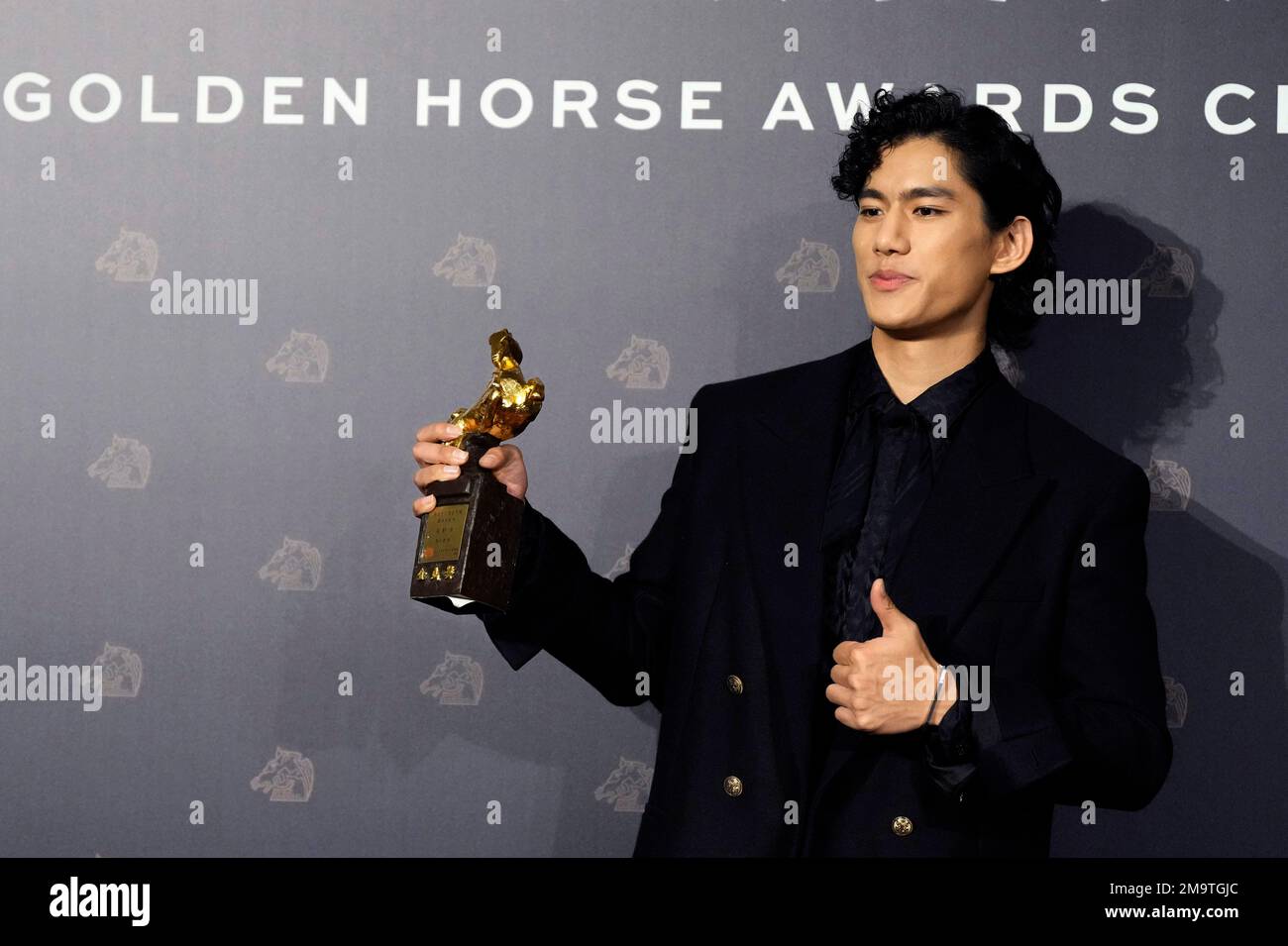 Taiwanese actor Berant Zhu holds his award for Best Supporting Actor at ...
