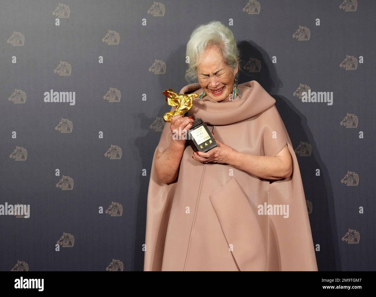 Taiwanese actress Kagaw Piling holds her award for Best Supporting ...
